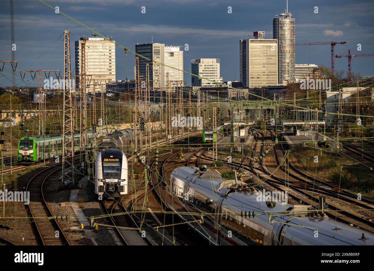 Train on the tracks west of Essen central station, city centre skyline ...