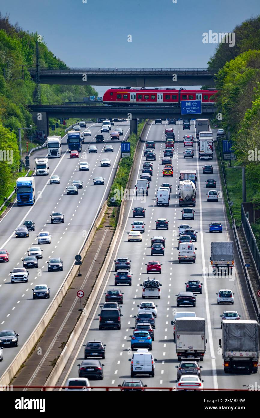 S-Bahn train, crossing the motorway A3, traffic on 8 lanes, incl. the ...
