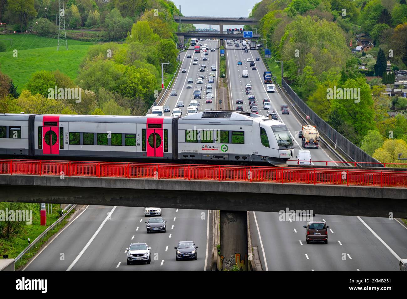 Local train S-Bahn, Regiobahn, S28, crossing the motorway A3, traffic ...