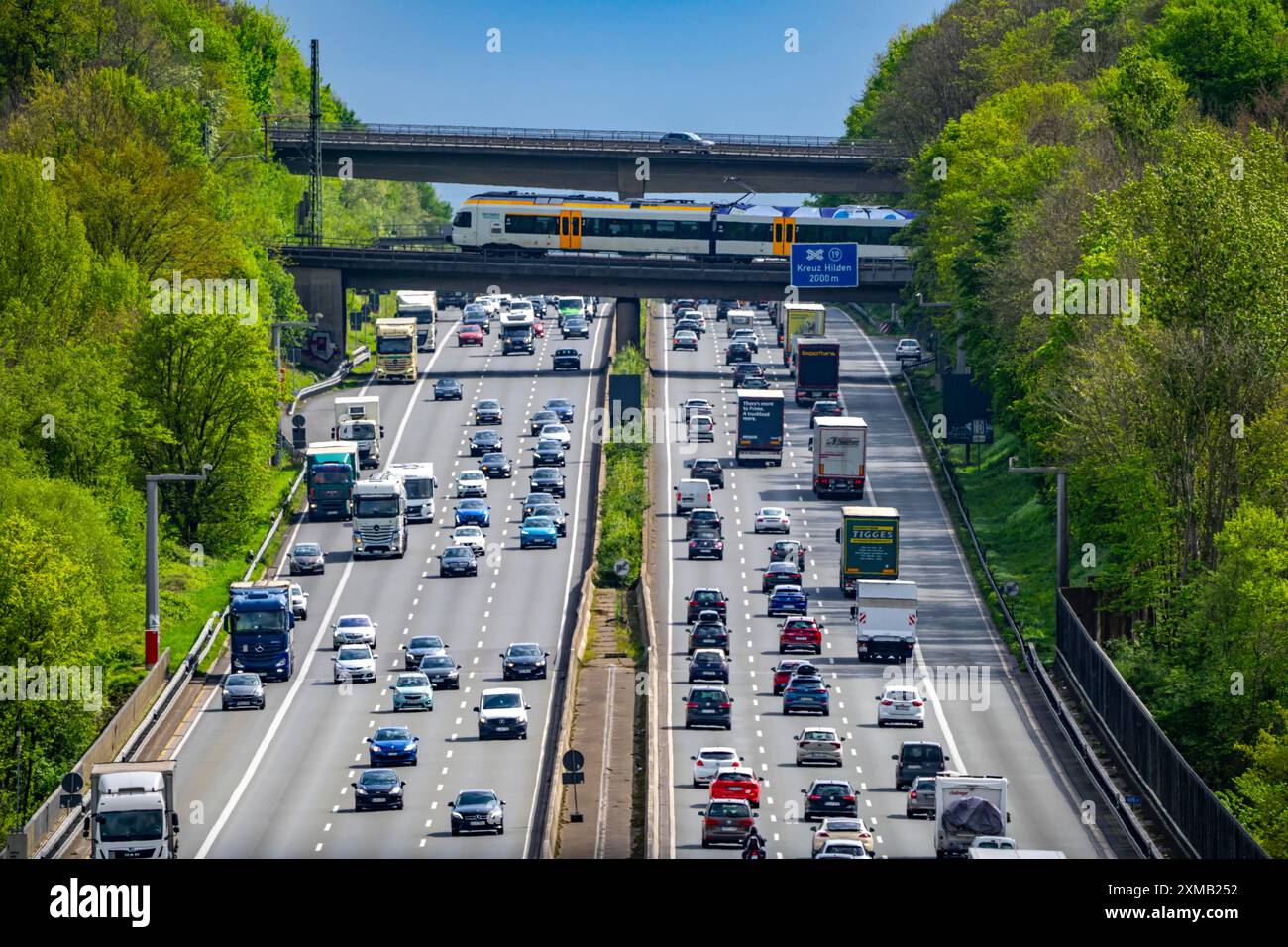 Eurobahn train, crossing the A3 motorway, traffic on 8 lanes, including ...