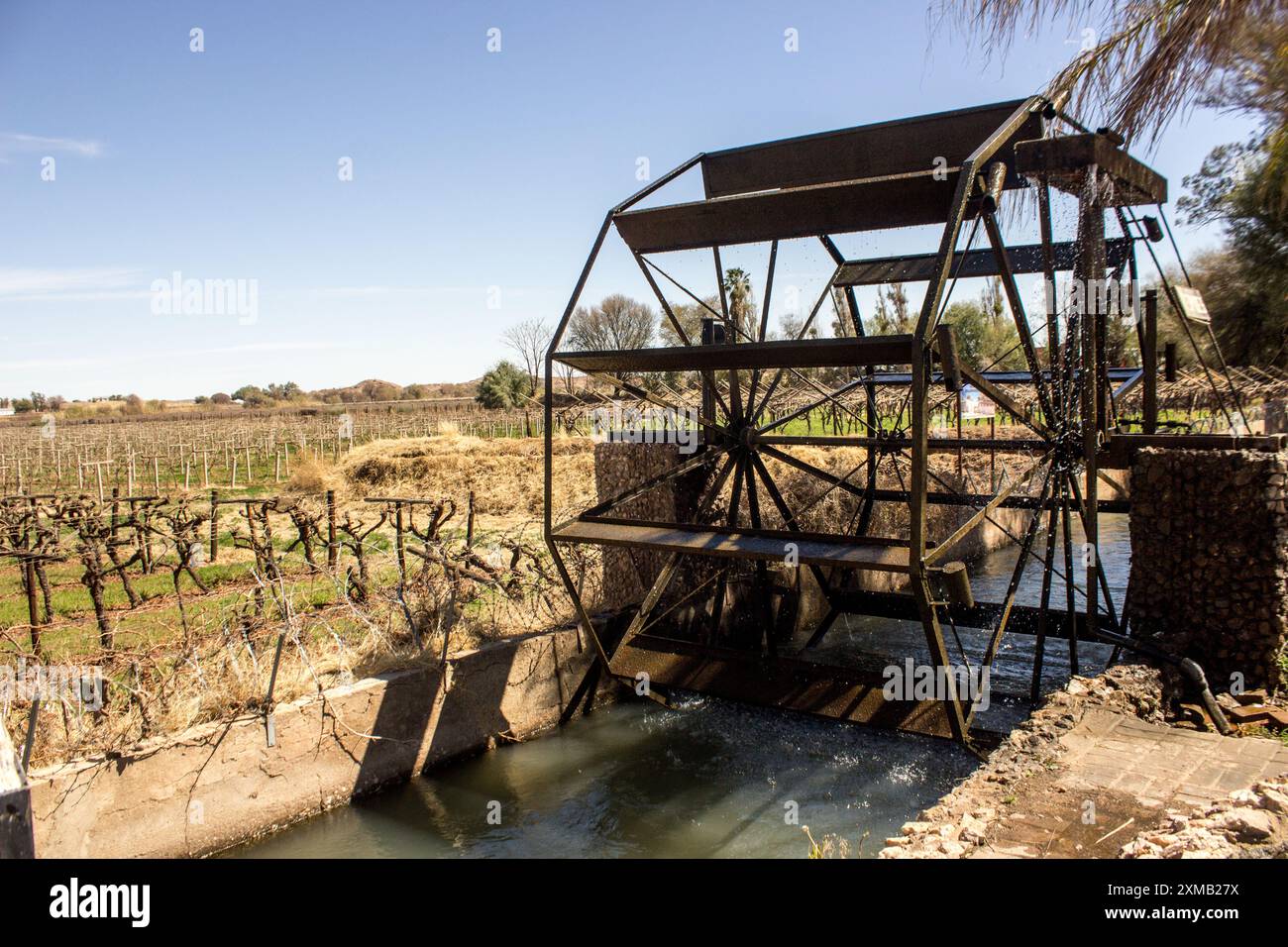 The waterwheel at Keimoes with Vineyards in the background Stock Photo ...