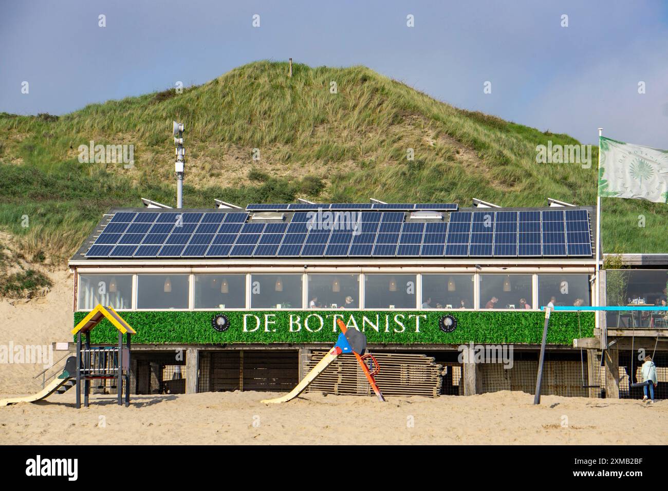 Solar modules on roofs, on the roof of a beach restaurant in Zeeland ...