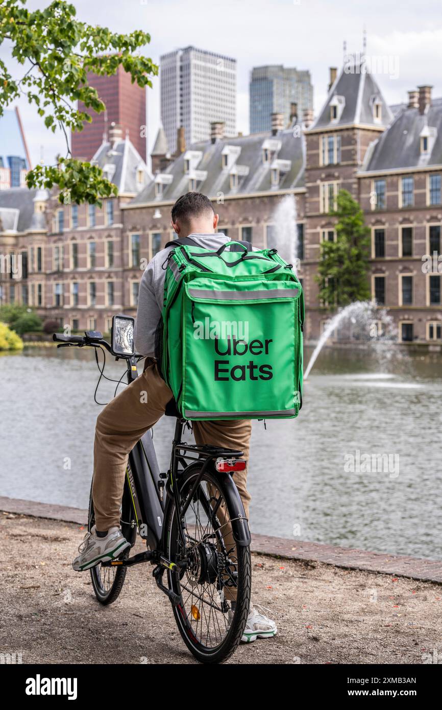 Uber Eats delivery service, delivery driver taking a break, at the ...