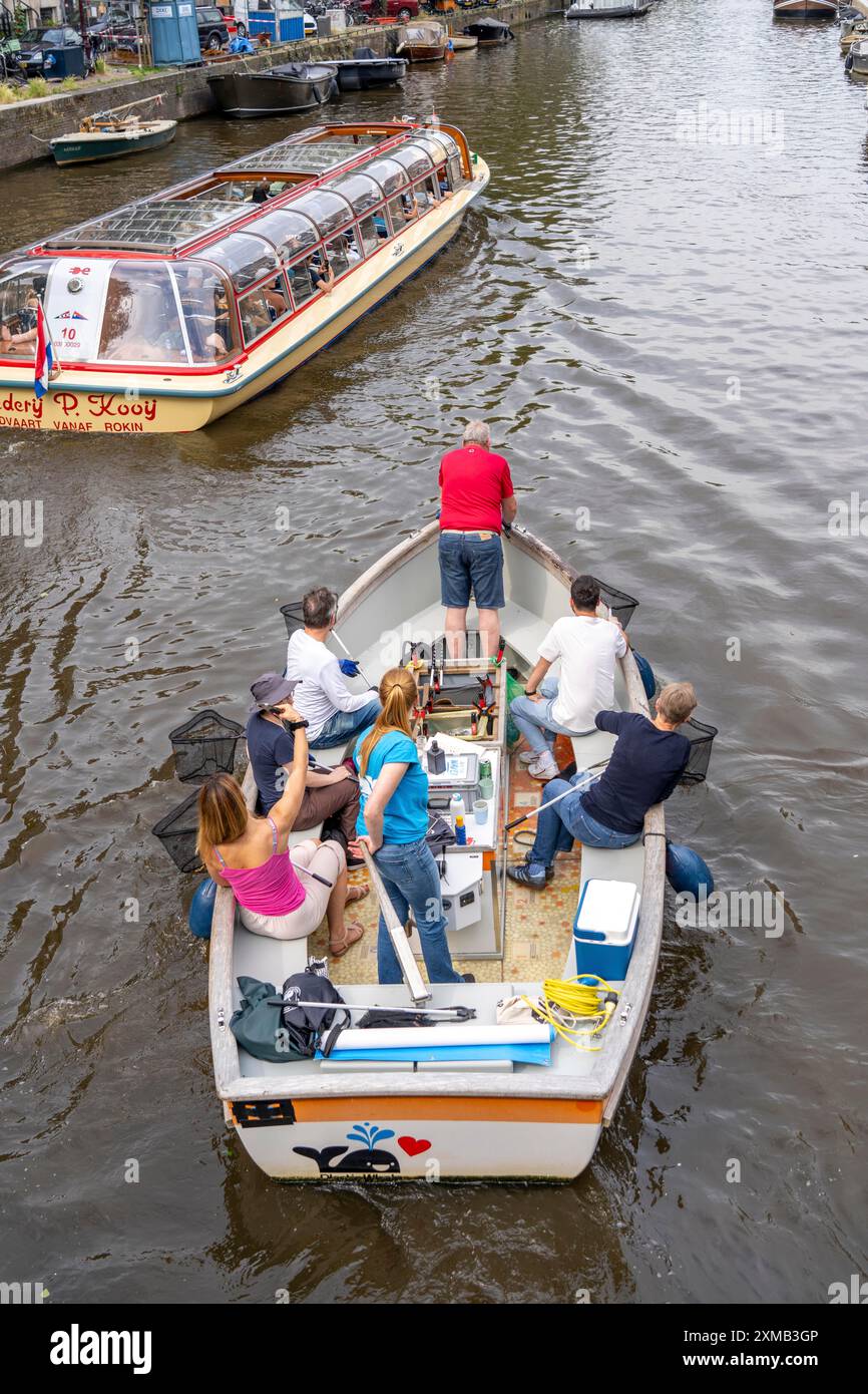 Plastic Whale boat in a canal in Amsterdam, passengers fish plastic ...