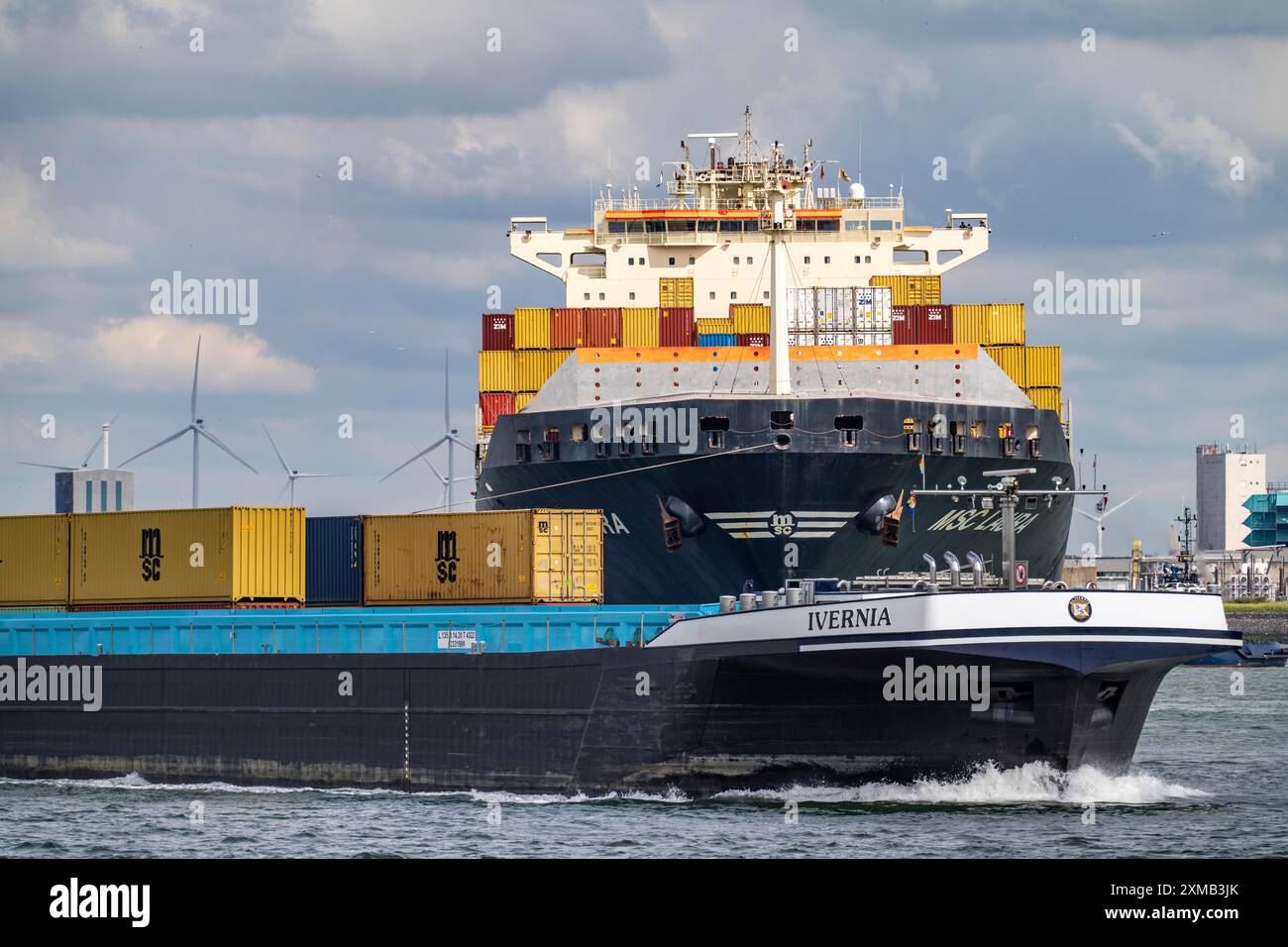 Europahaven, MSC Laura container freighter being towed by harbour tugs ...