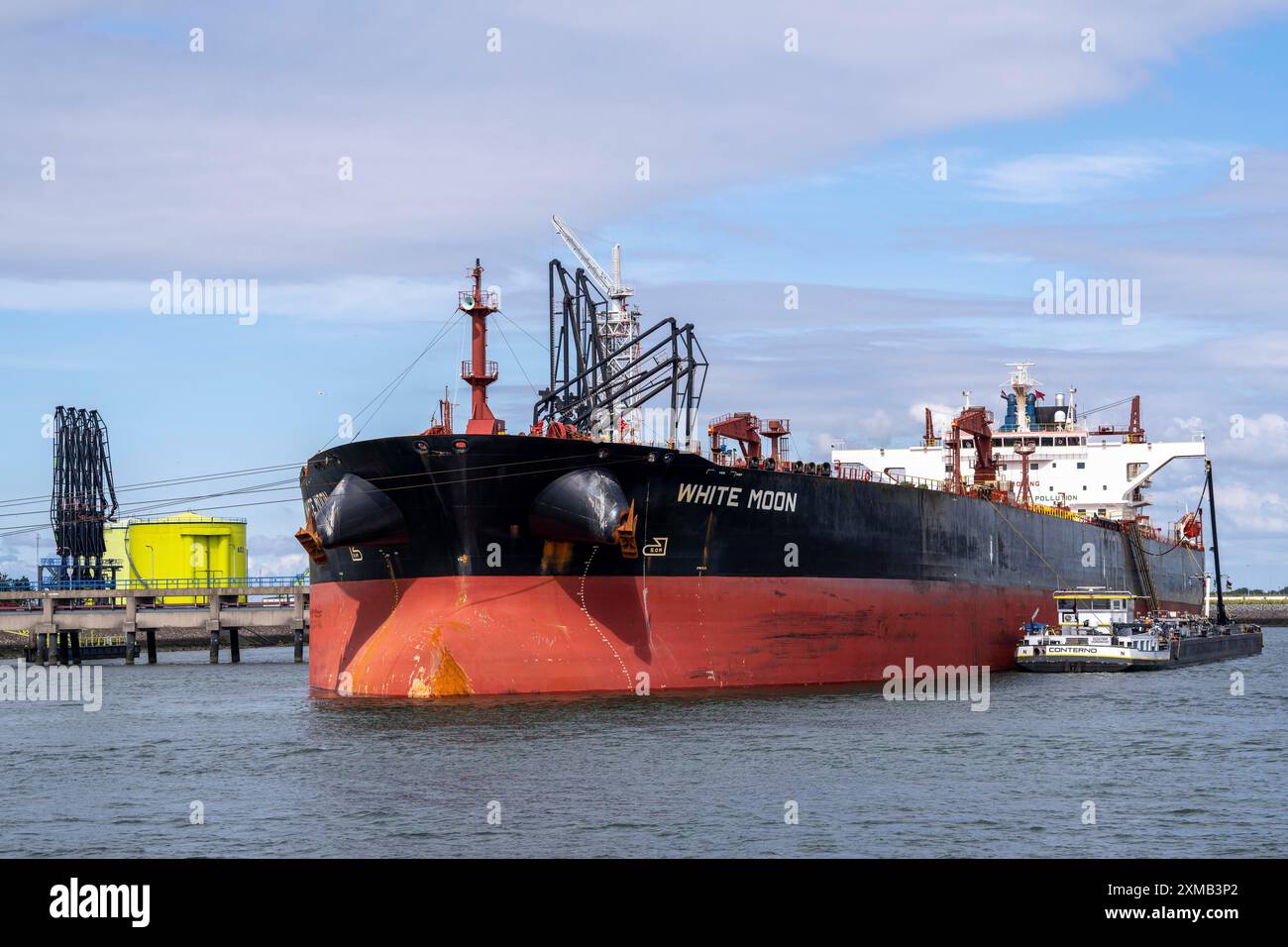 Large tanker White Moon being unloaded, for crude oil, in the petroleum ...