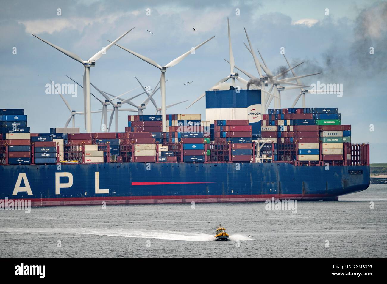 Entrance to the seaport of Rotterdam, APL Raffles container freighter ...