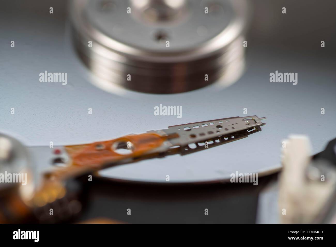 Computer hard drive, opened, read/write head on the storage disc. Symbol image Stock Photo - Alamy