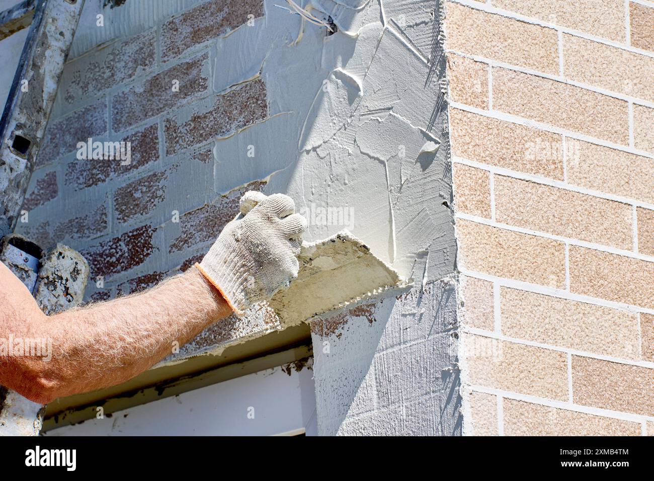 Facade cladding with flexible thin brick veneer panel reinforced with ...