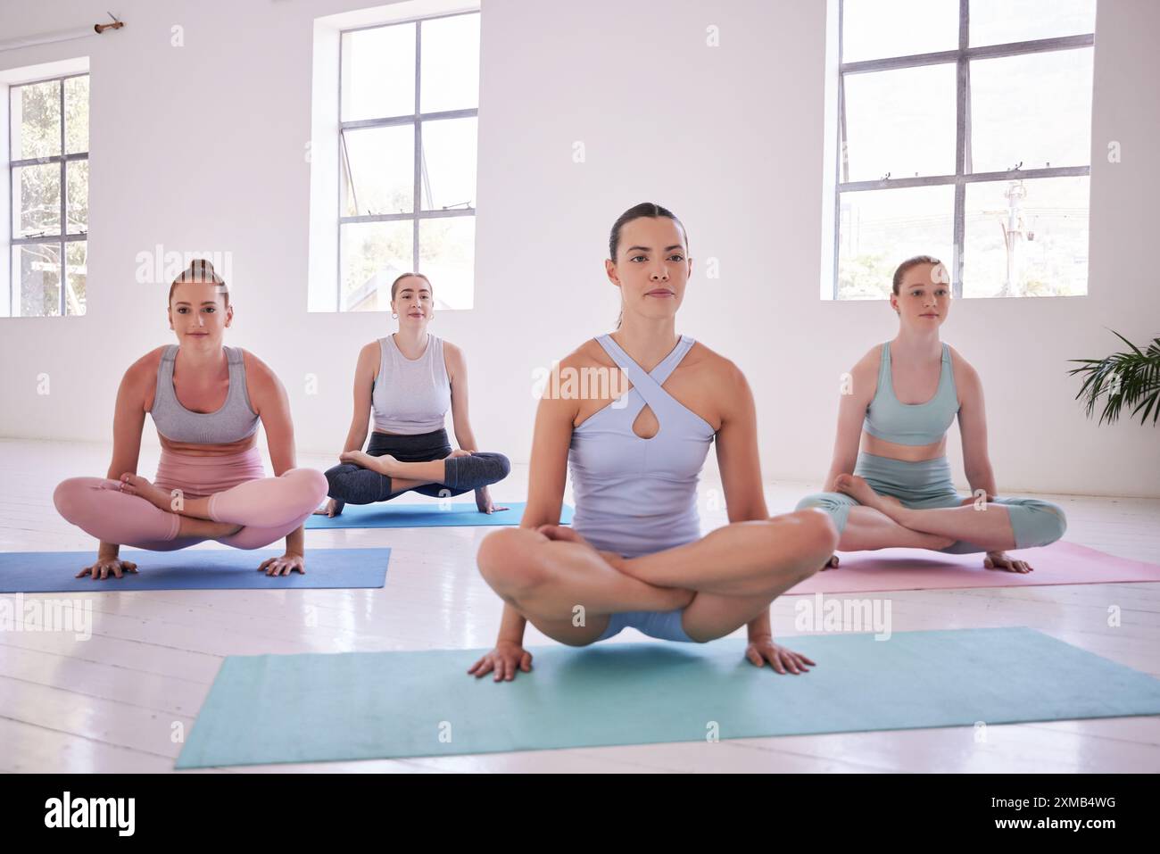 Yoga, women and scale pose for fitness on mat with posture, balance and ...