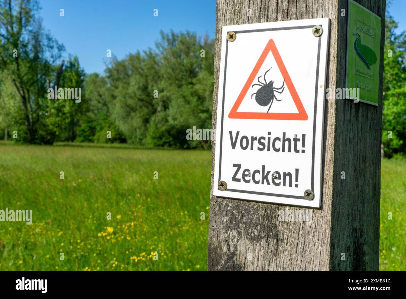 Warning signs for ticks, in the Urdenbachen Kaempe nature reserve ...