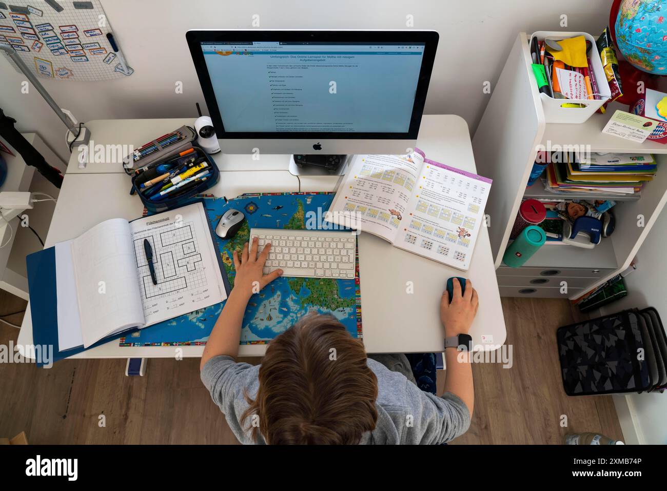 Young, primary school pupils, home learning, doing schoolwork, distance ...