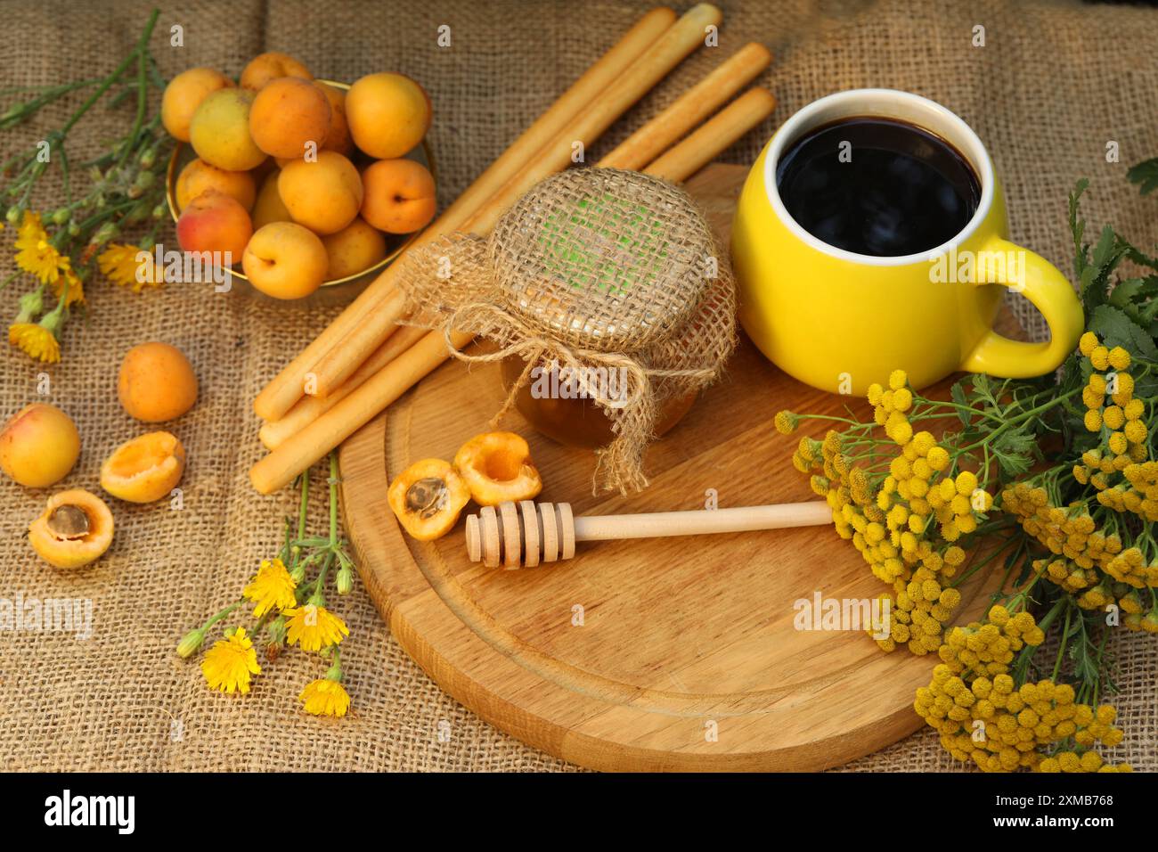 Summer still life picture with coffee, honey, apricots and yellow ...