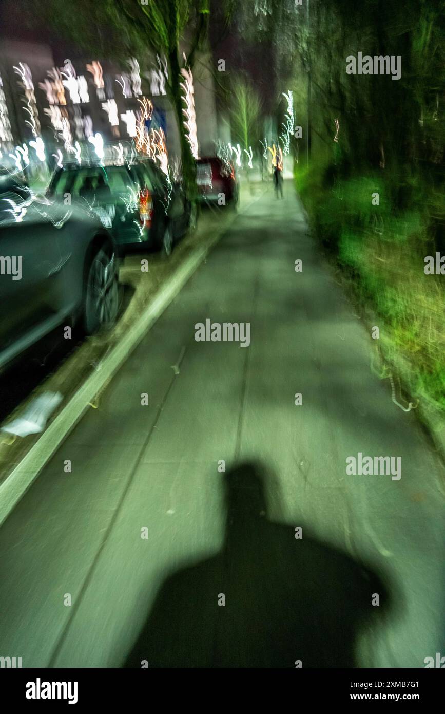 Pedestrian path in the evening, dark, little lighting from street lamps ...