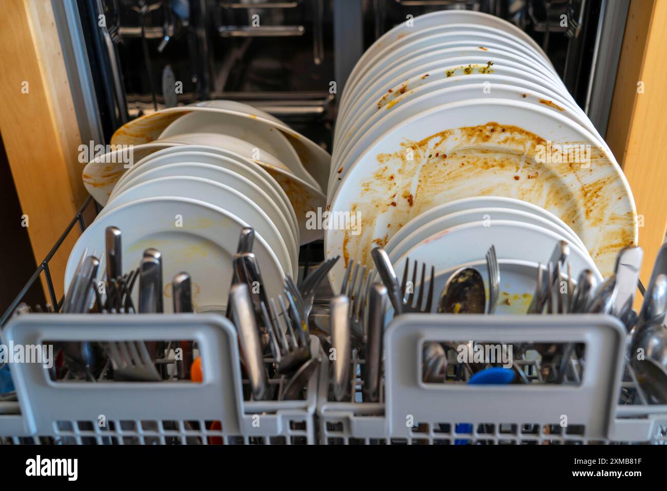 Dishwasher, full of dirty crockery Stock Photo - Alamy