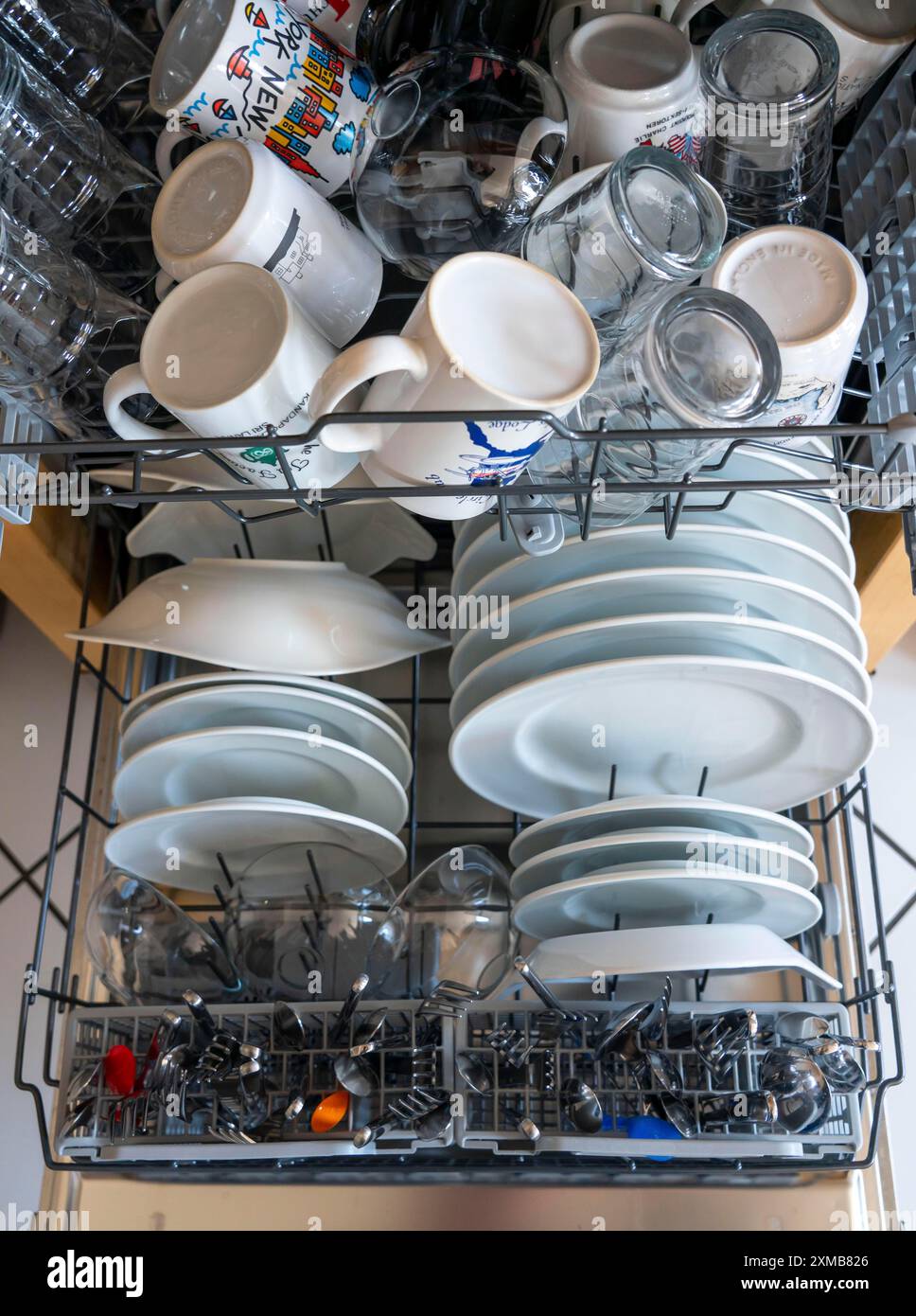 Dishwasher, full of clean crockery Stock Photo - Alamy