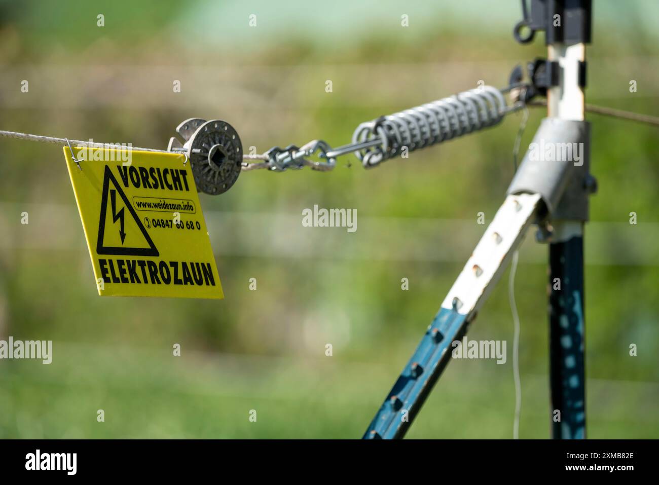 Electric fence on a pasture, warning sign, electric shock Stock Photo ...