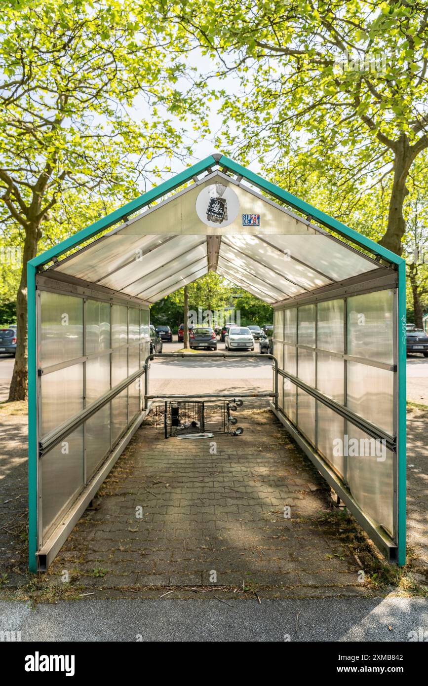 Shelter for shopping trolleys, empty, abandoned in a car park, no ...