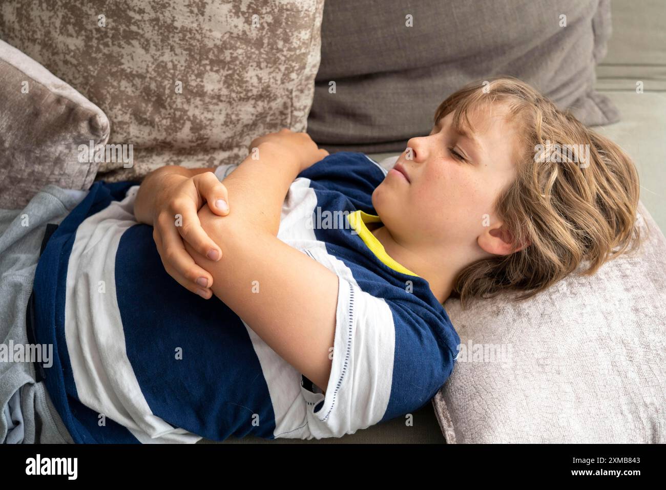 Growing pains in children, boy, 10 years old, has pain in his arm ...