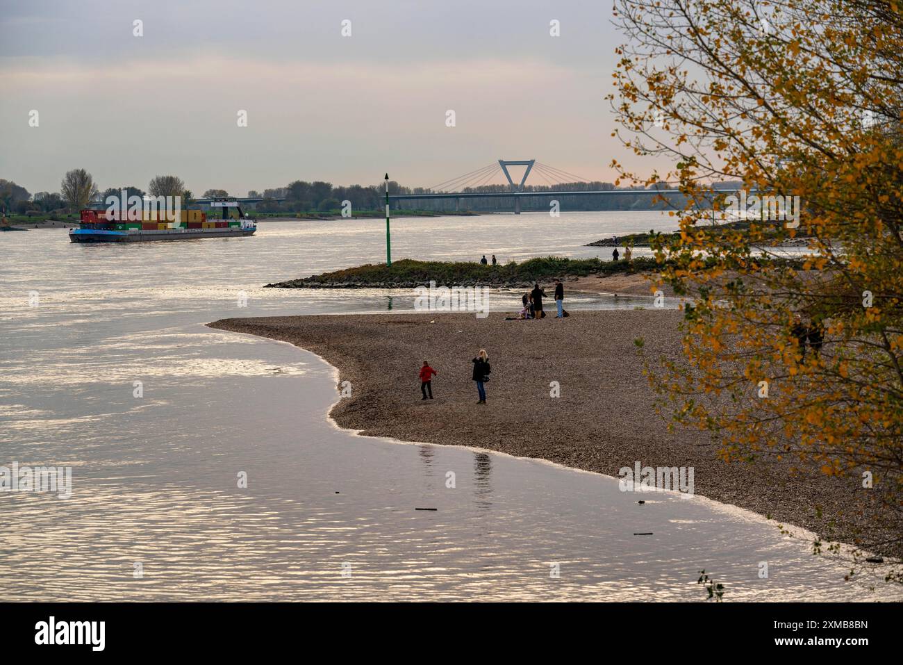 Walkers on the Rhine beach between Duesseldorf and Krefeld, container ...