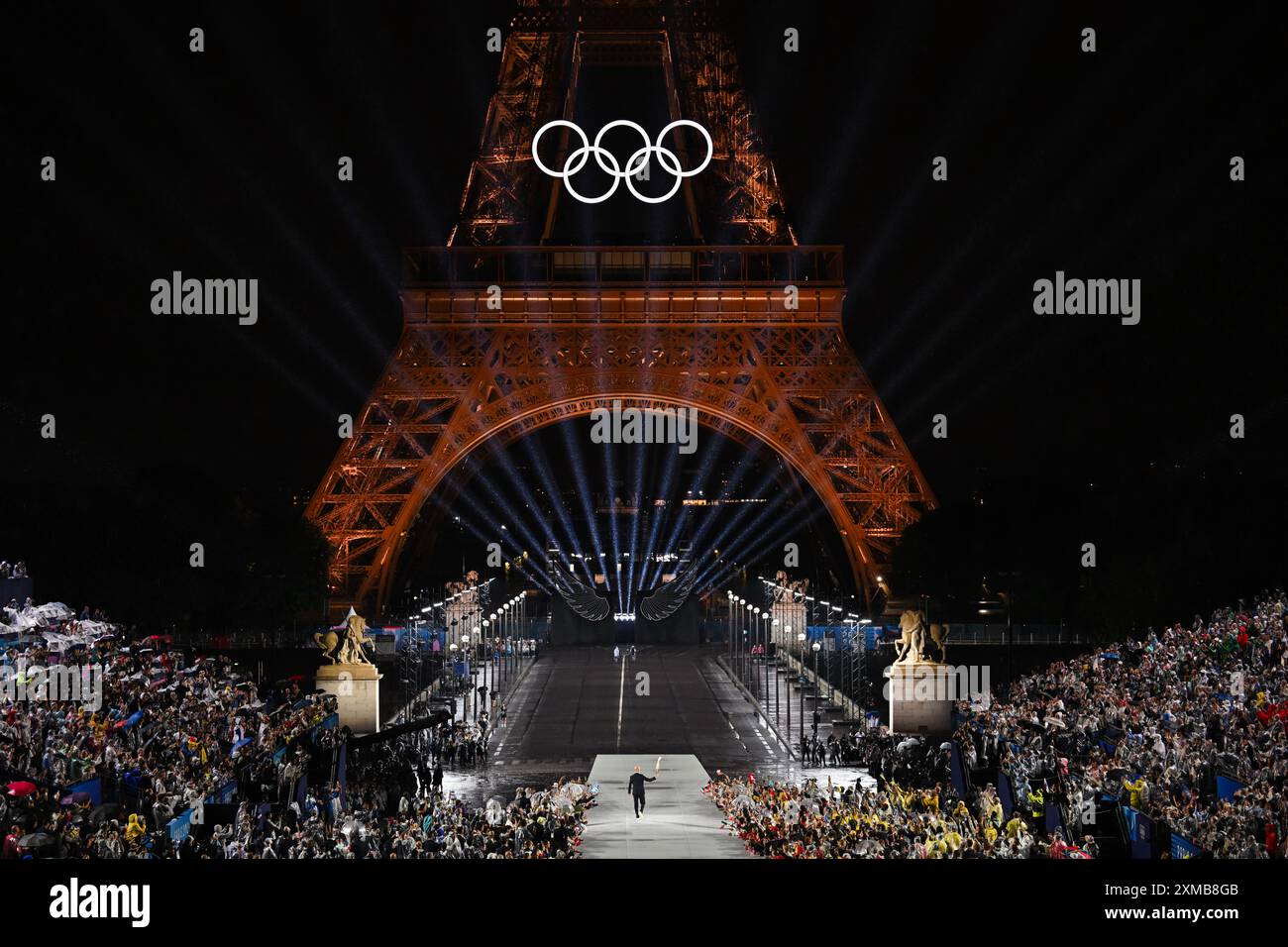 Zinedine Zidane with the Olympic Flame during the opening ceremony of ...