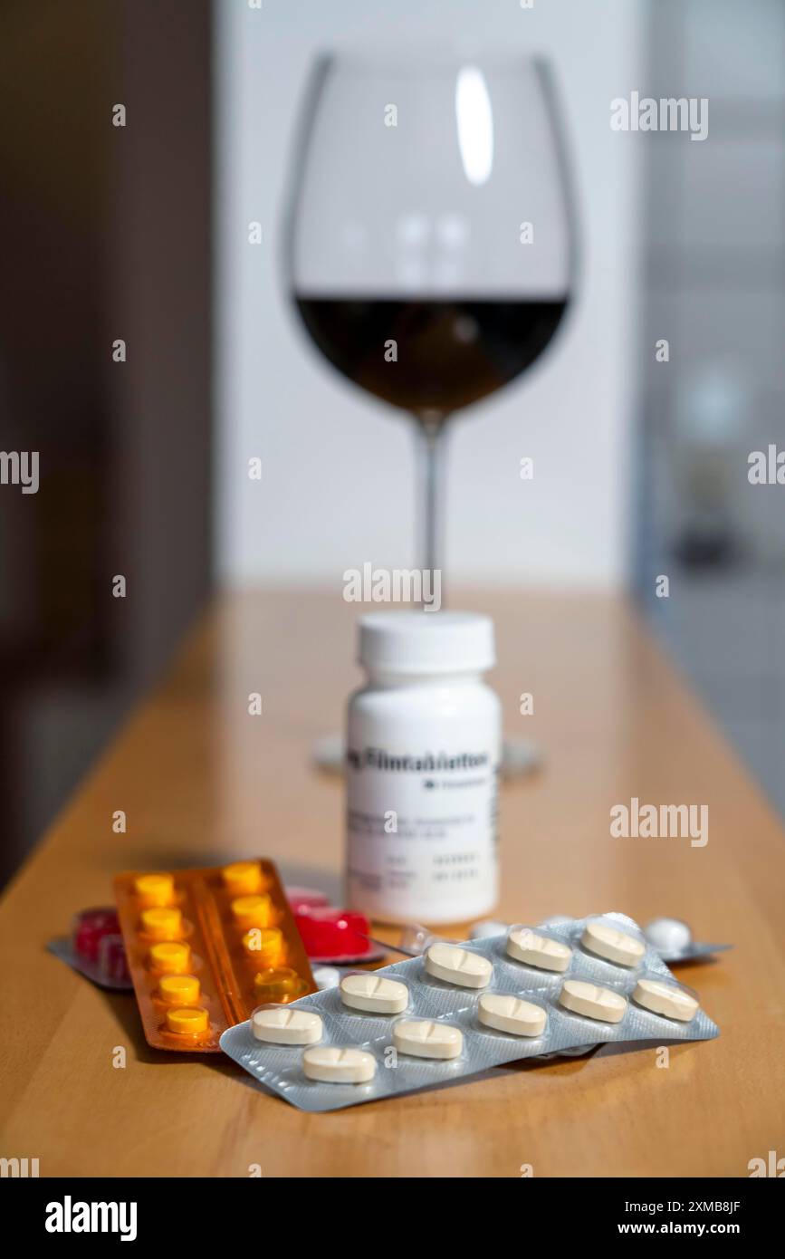 Symbolic image of alcohol and medication, you should not take medicine ...