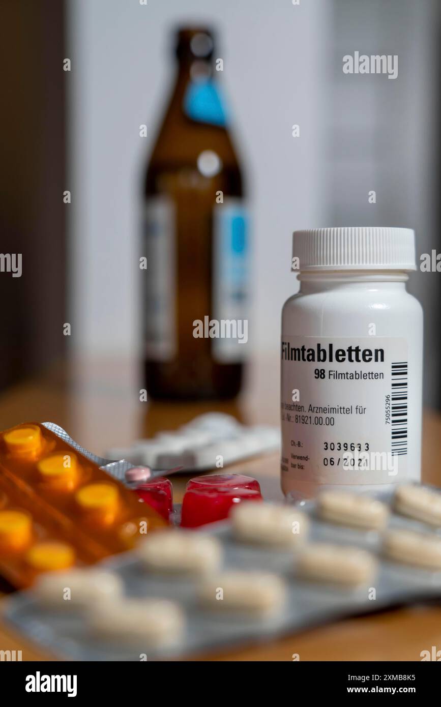 Symbolic image of alcohol and medication, you should not take medicine ...