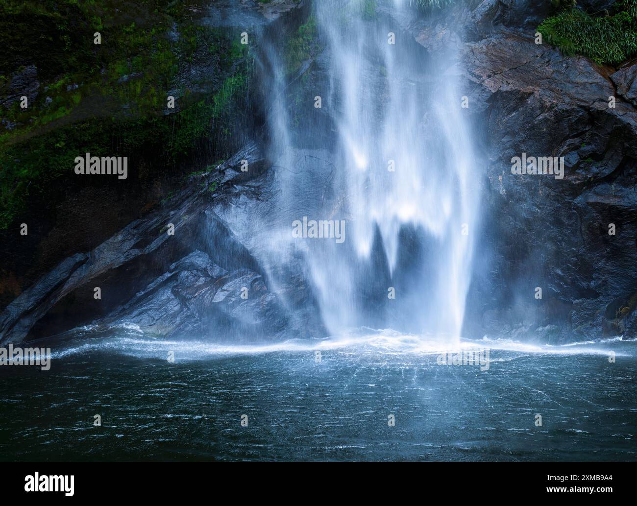 Stirling Falls plunging vertically over the cliff into Milford Sound ...
