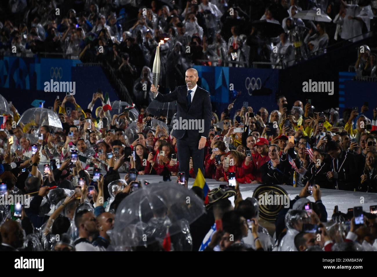 Zinadine Zidane with the Olympic torch, Opening Ceremony during the ...