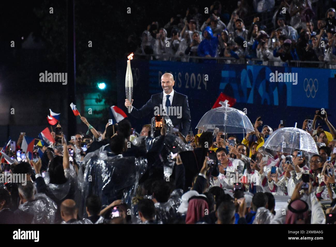 Zinadine Zidane with the Olympic torch, Opening Ceremony during the ...