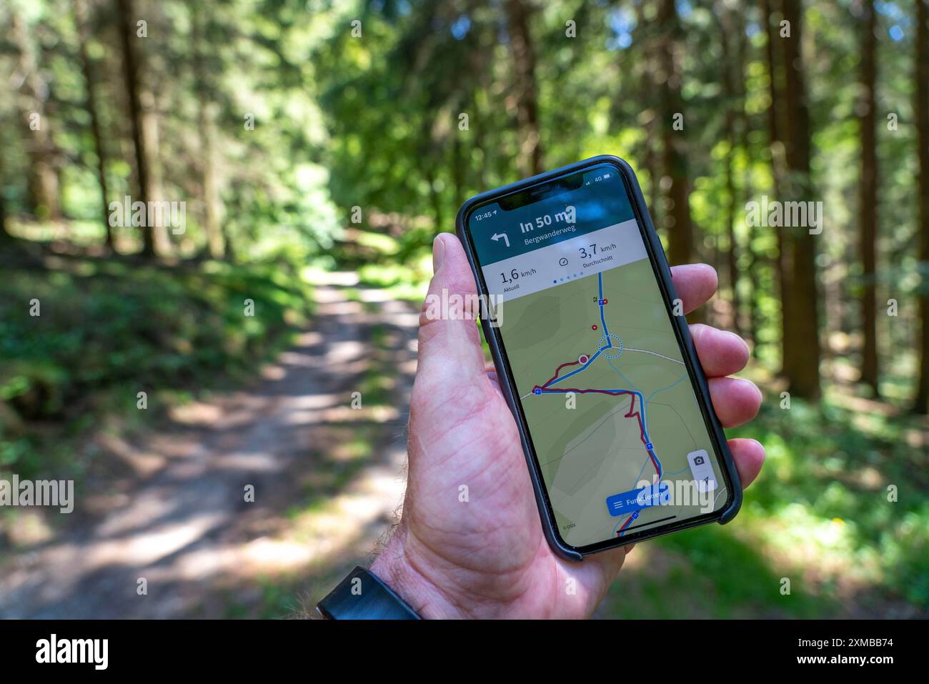 Hiking, smartphone with hiking app, navigation on hiking trails ...