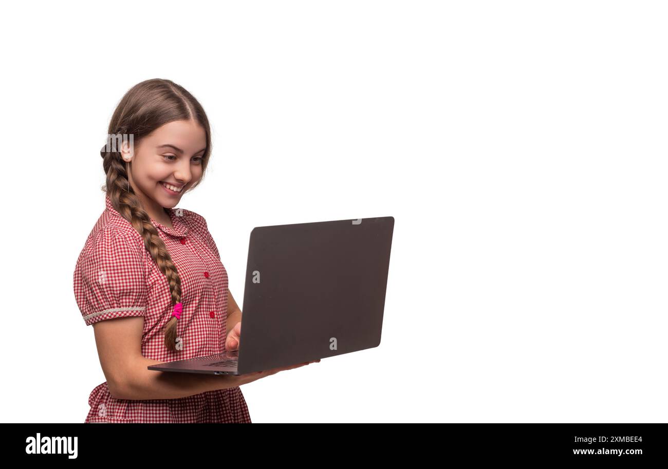 Typing school blog on laptop. Student at video lesson. Teen girl use ...