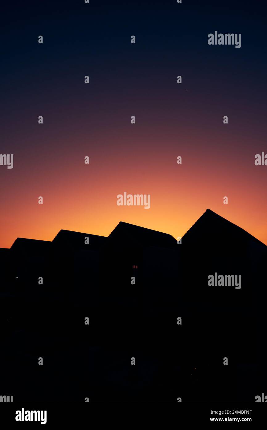 A dramatic twilight moment at Bali, the sky is lit with bright purple ...