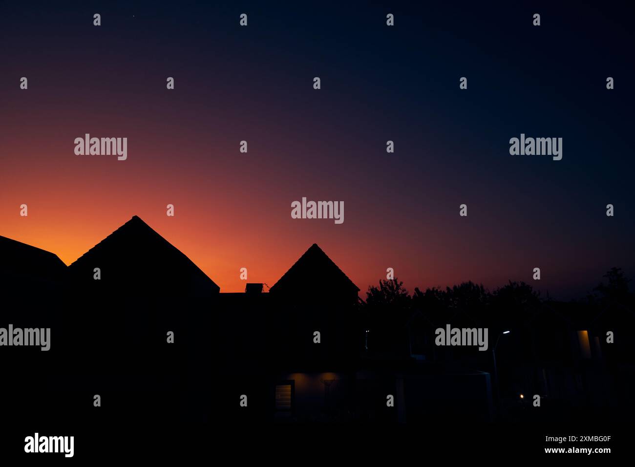 A dramatic twilight moment at Bali, the sky is lit with bright purple ...