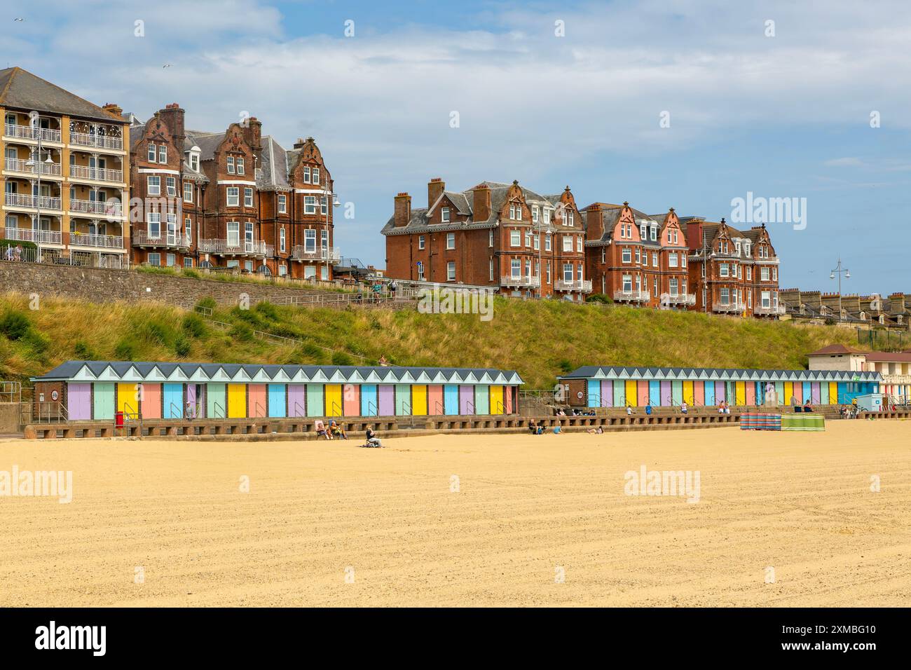 Colourful beach huts and historic clifftop buildings, South Beach ...
