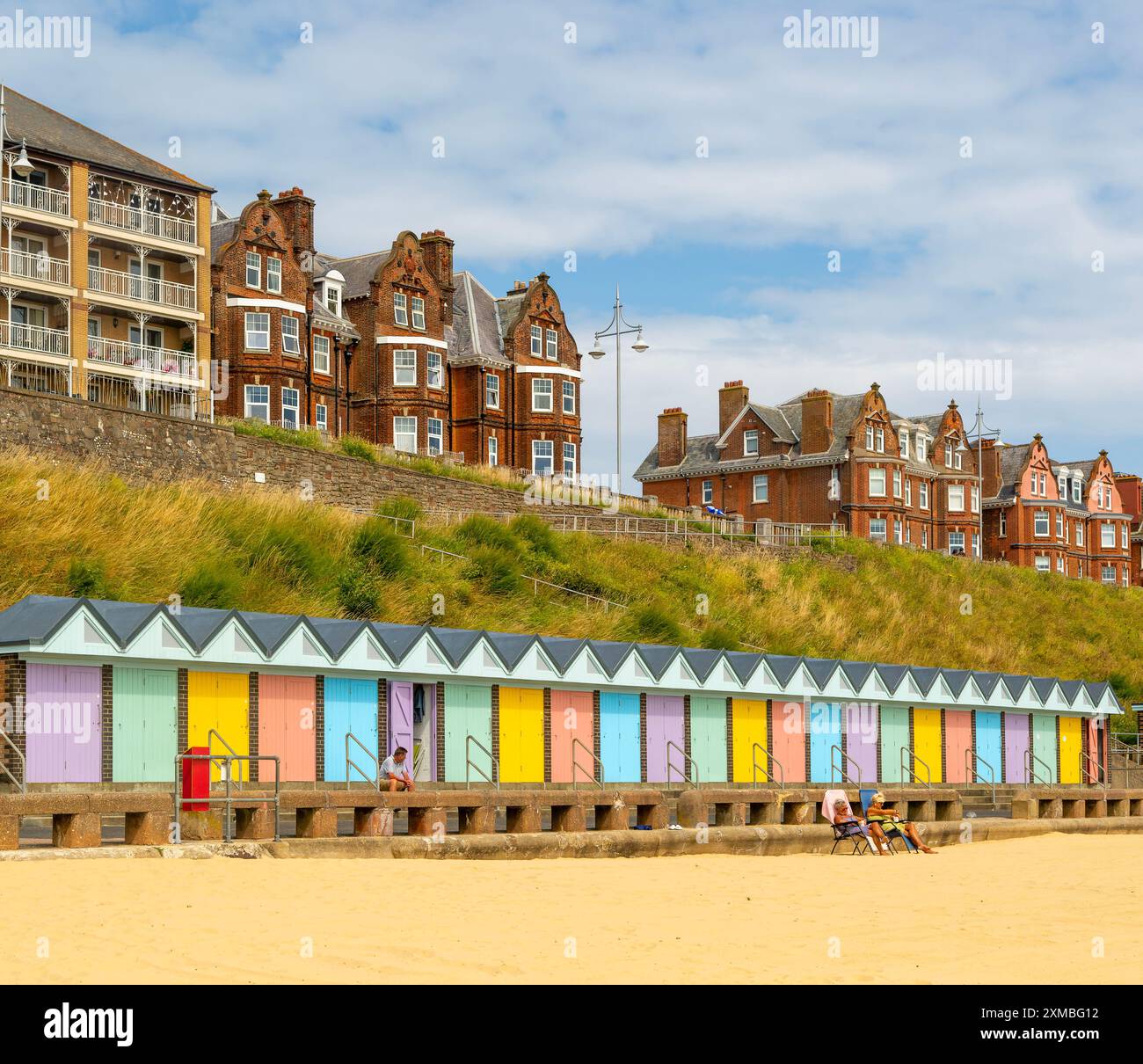 Colourful beach huts and historic clifftop buildings, South Beach ...