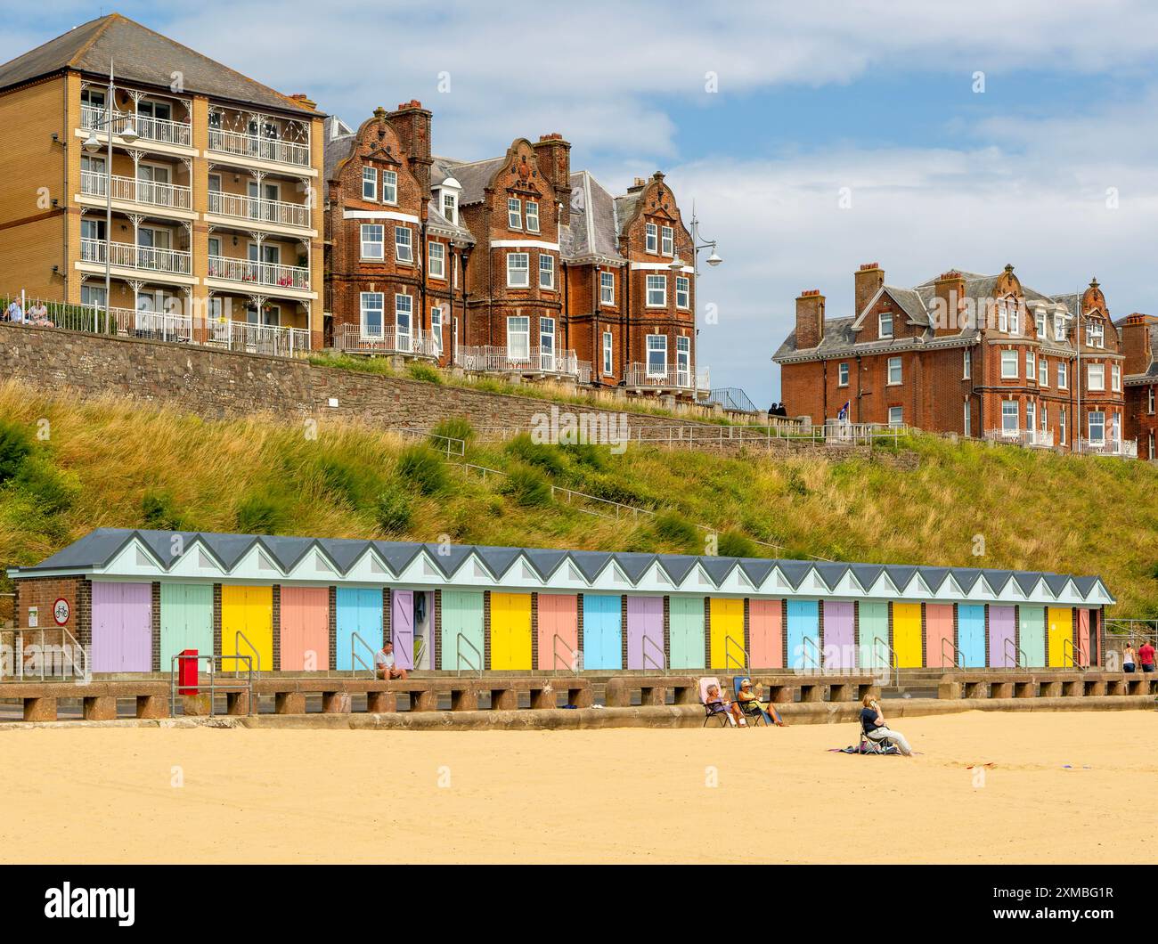 Colourful beach huts and historic clifftop buildings, South Beach ...