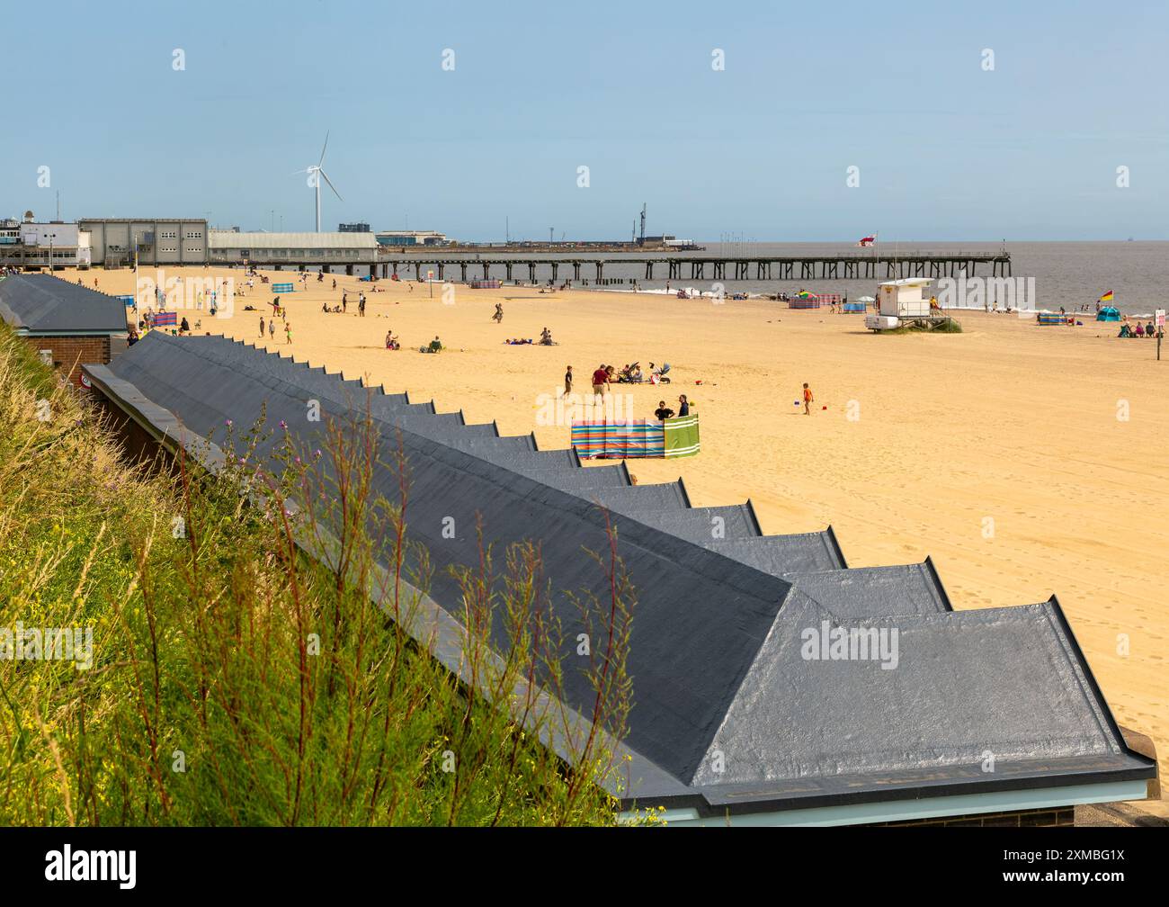 View over roofs of beach huts to Claremont Pier, South Beach, Lowestoft ...