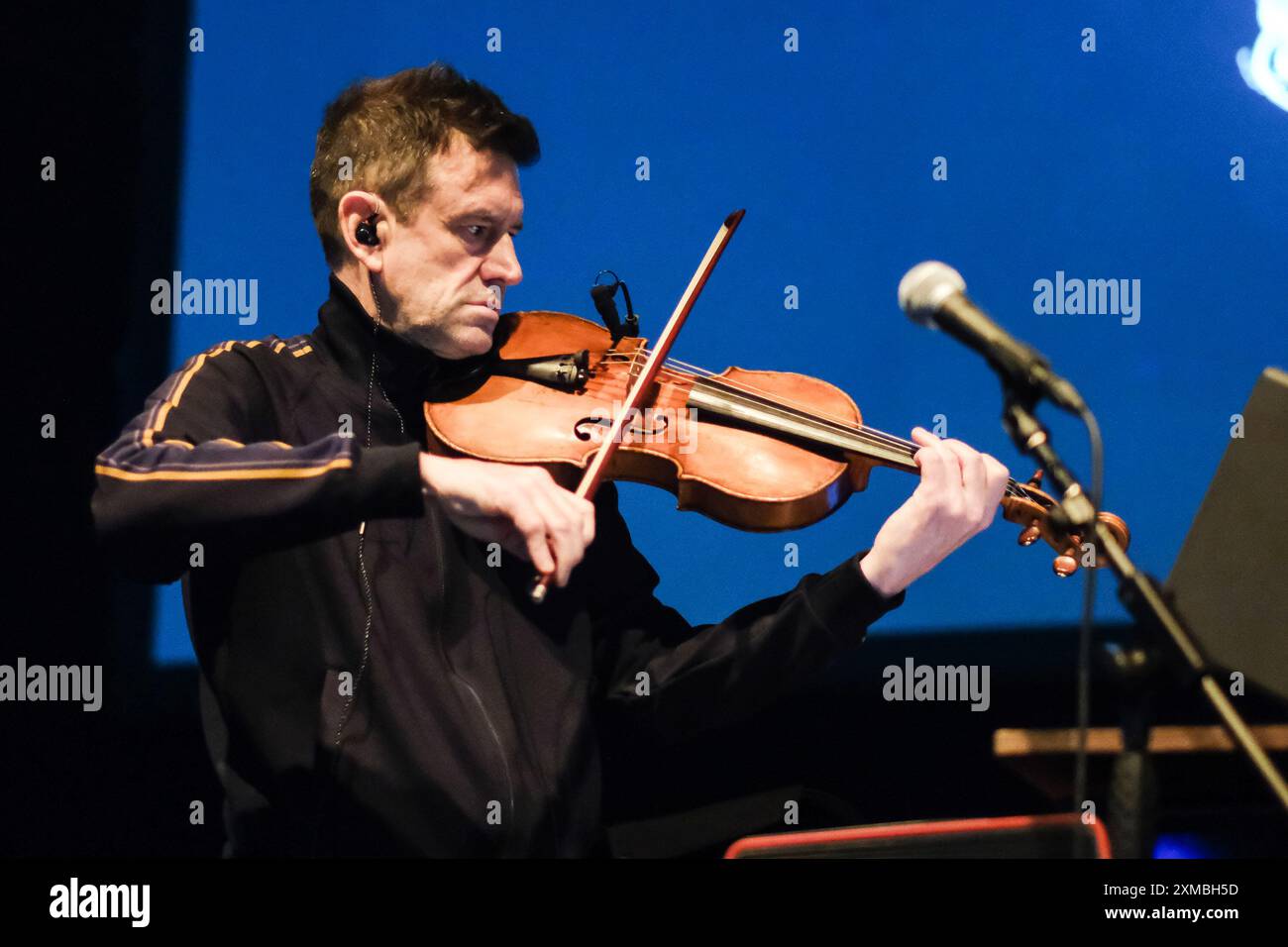 Malmesbury, UK. 26th July, 2024. John Metcalfe performs on the Siam ...