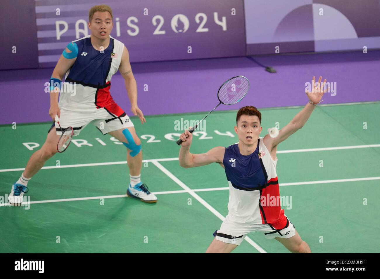 Malaysia's Aaron Chia, left, and Soh Wooi Yik play against Britain's ...