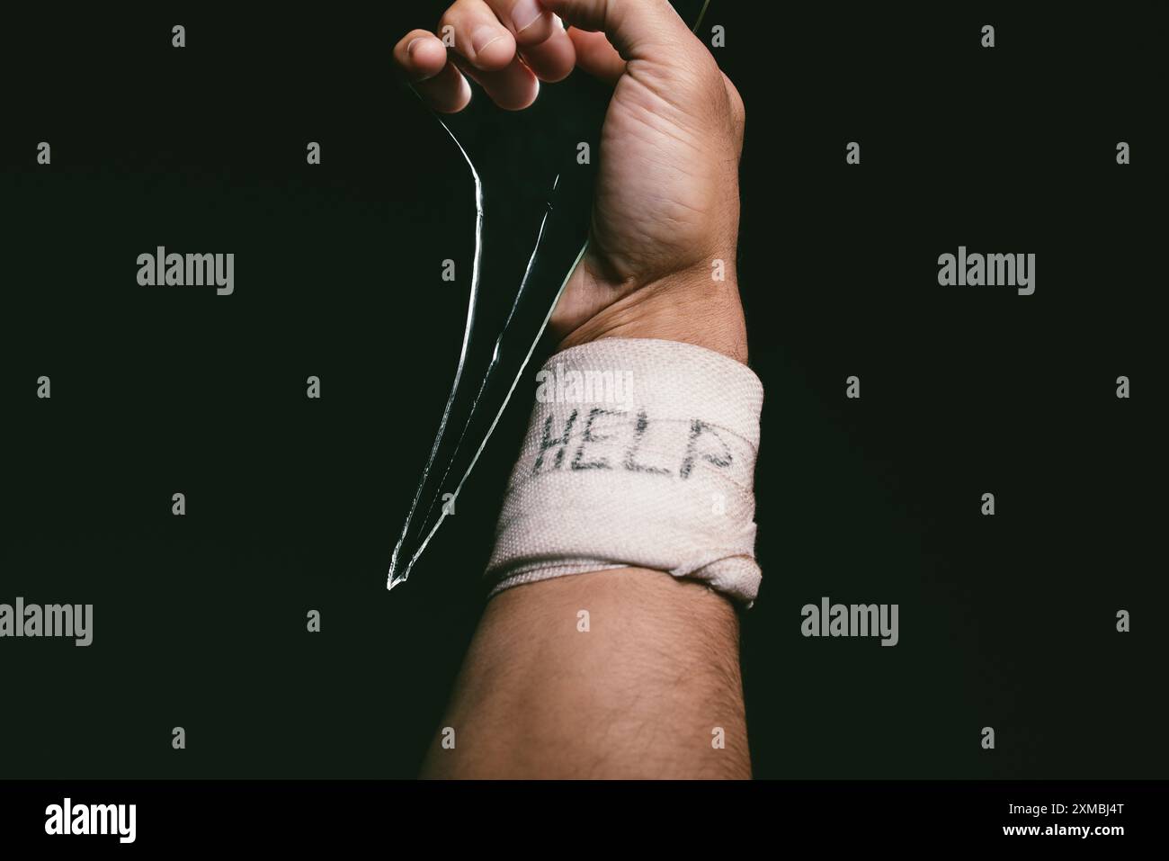 Hand, bandage and help in black background for depression, bipolar ...
