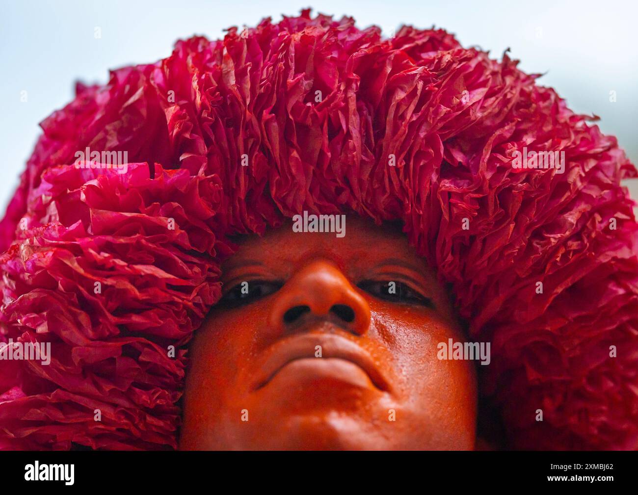 Portrait of a Hindu devotee covered with orange color in Lal Kach ...