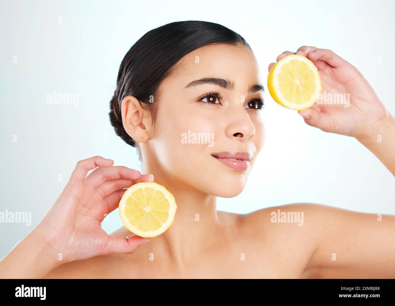 Beauty, woman and lemon for skincare in studio with vitamin c, acne ...