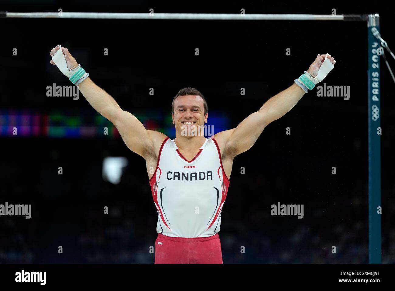 Rene Cournoyer, of Canada, competes on the horizontal bar during a men ...