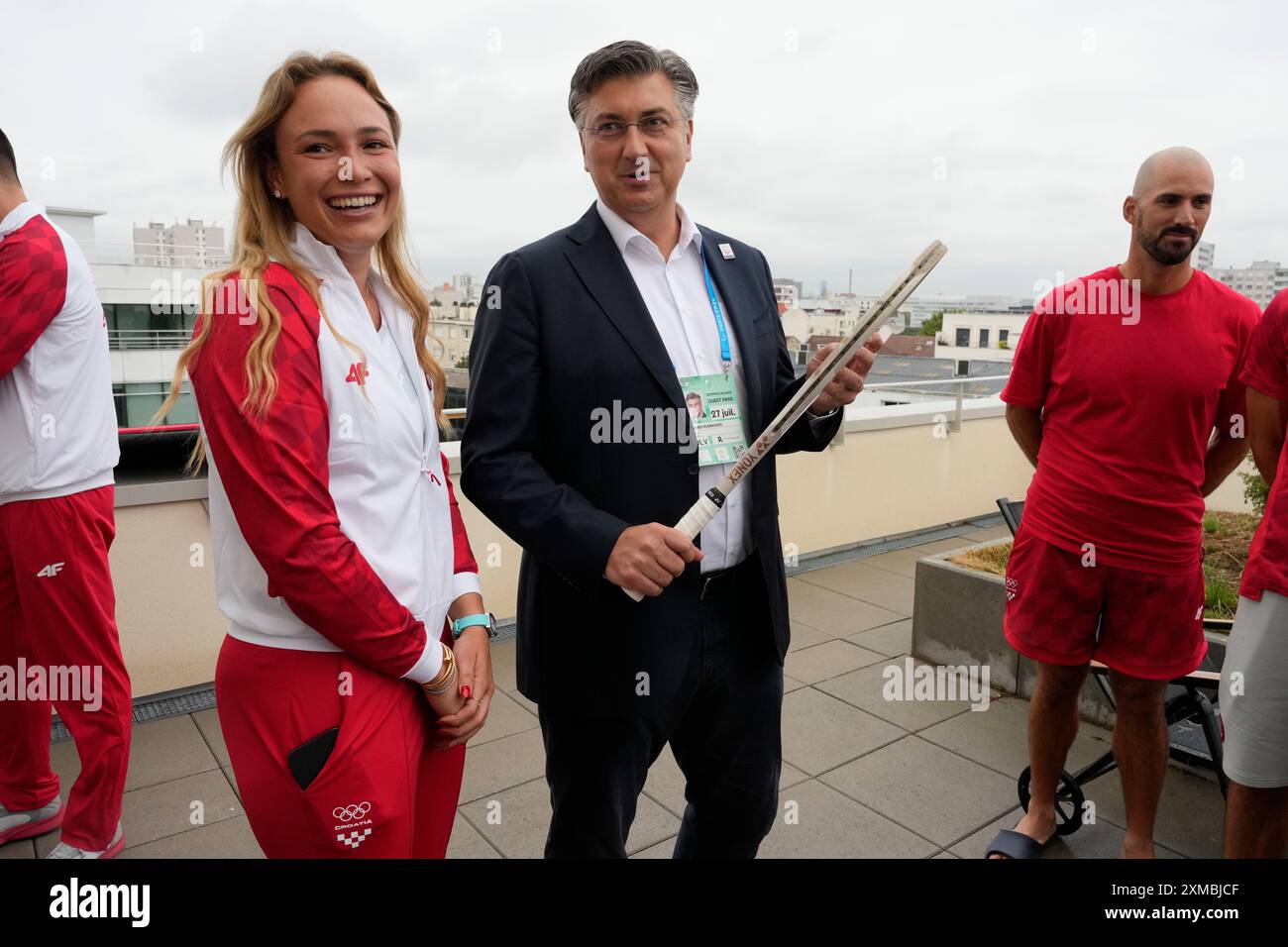 Prime Minister of Croatia Andrej Plenkovic , holds a tennis racket next ...