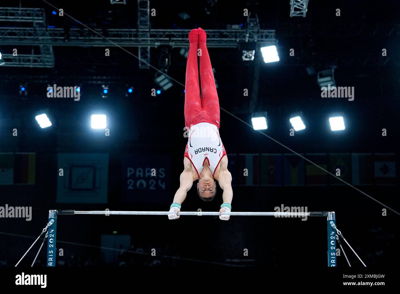 Rene Cournoyer, of Canada, competes on the horizontal bar during a men ...