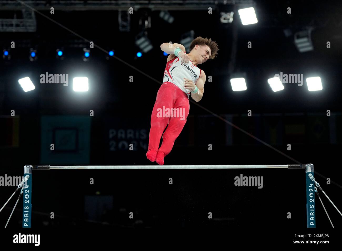 Samuel Zakutney, of Canada, competes on the horizontal bar during a men ...