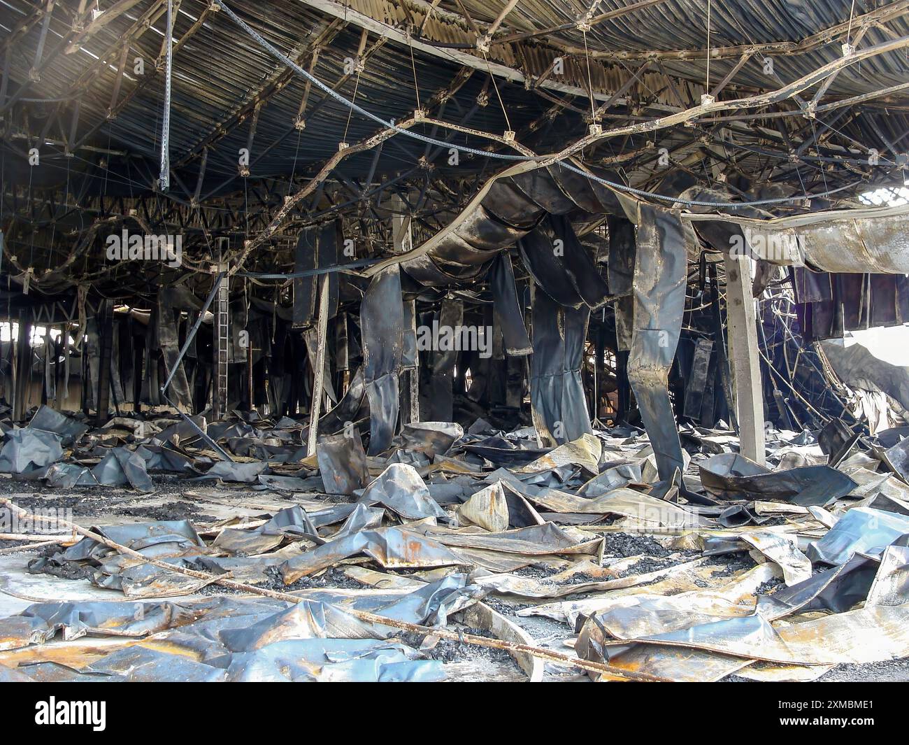 Aftermath of a fire at a construction site, showing extensive damage to ...