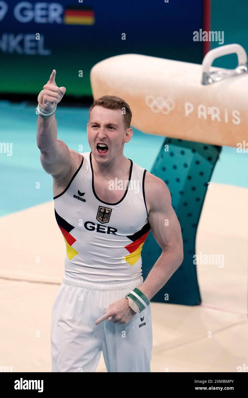 Nils Dunkel, of Germany, celebrates after competing on the pommel horse ...