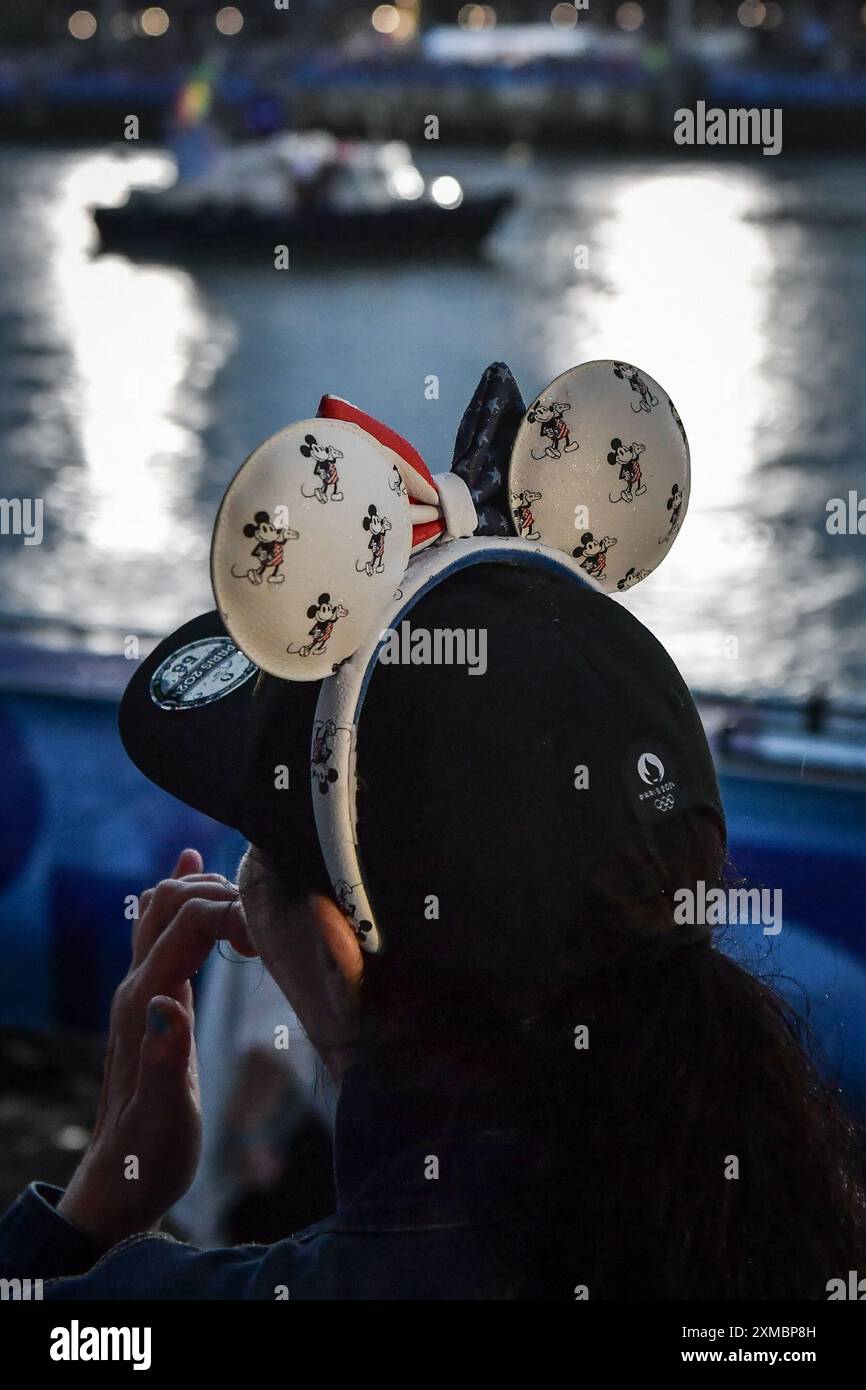 Paris, France. 26th July, 2024. A fan wearing Paris 2024 cap attends ...